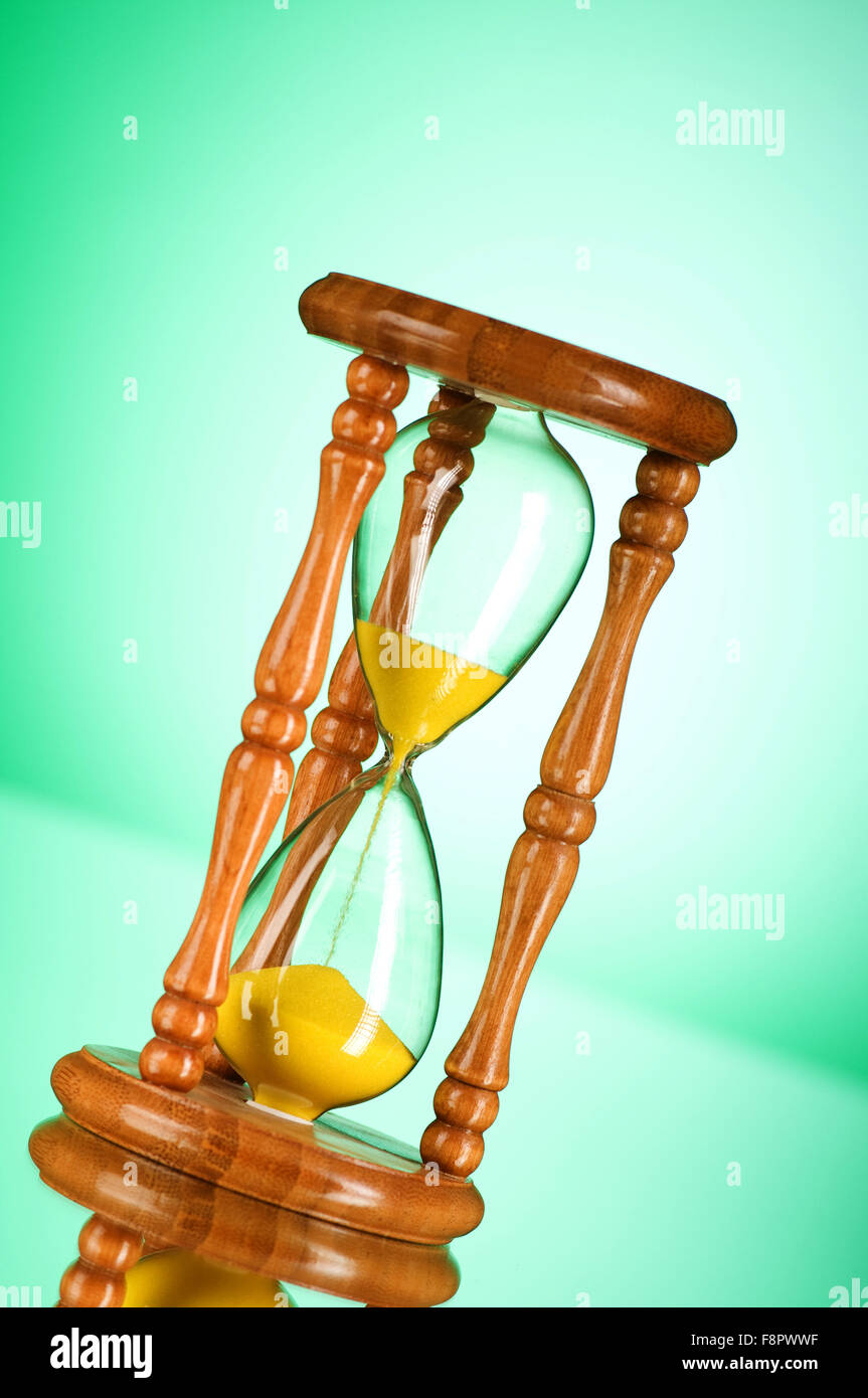 Time concept - hourglass against the gradient background Stock Photo ...