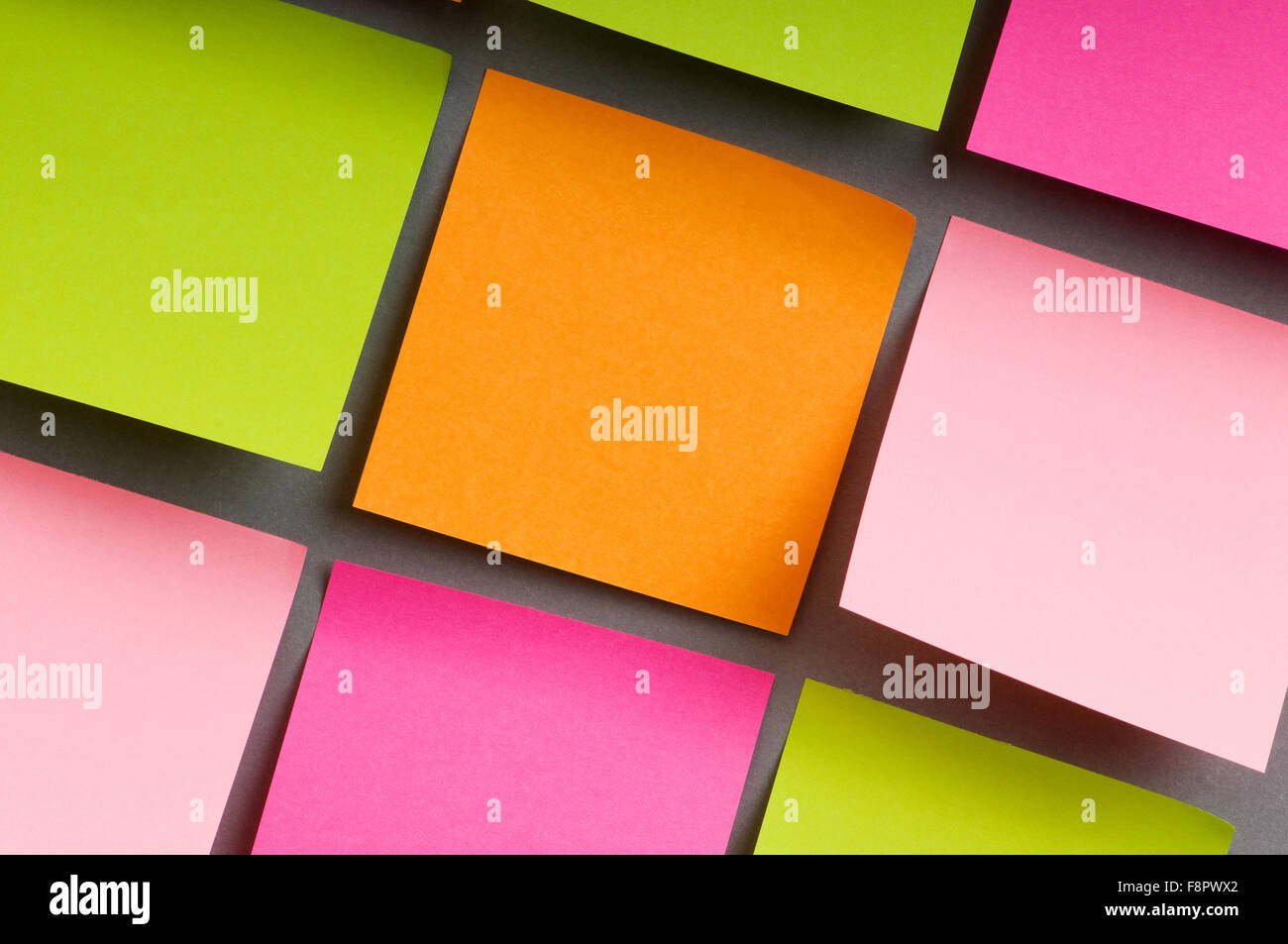 Reminder notes on the bright colorful paper Stock Photo - Alamy