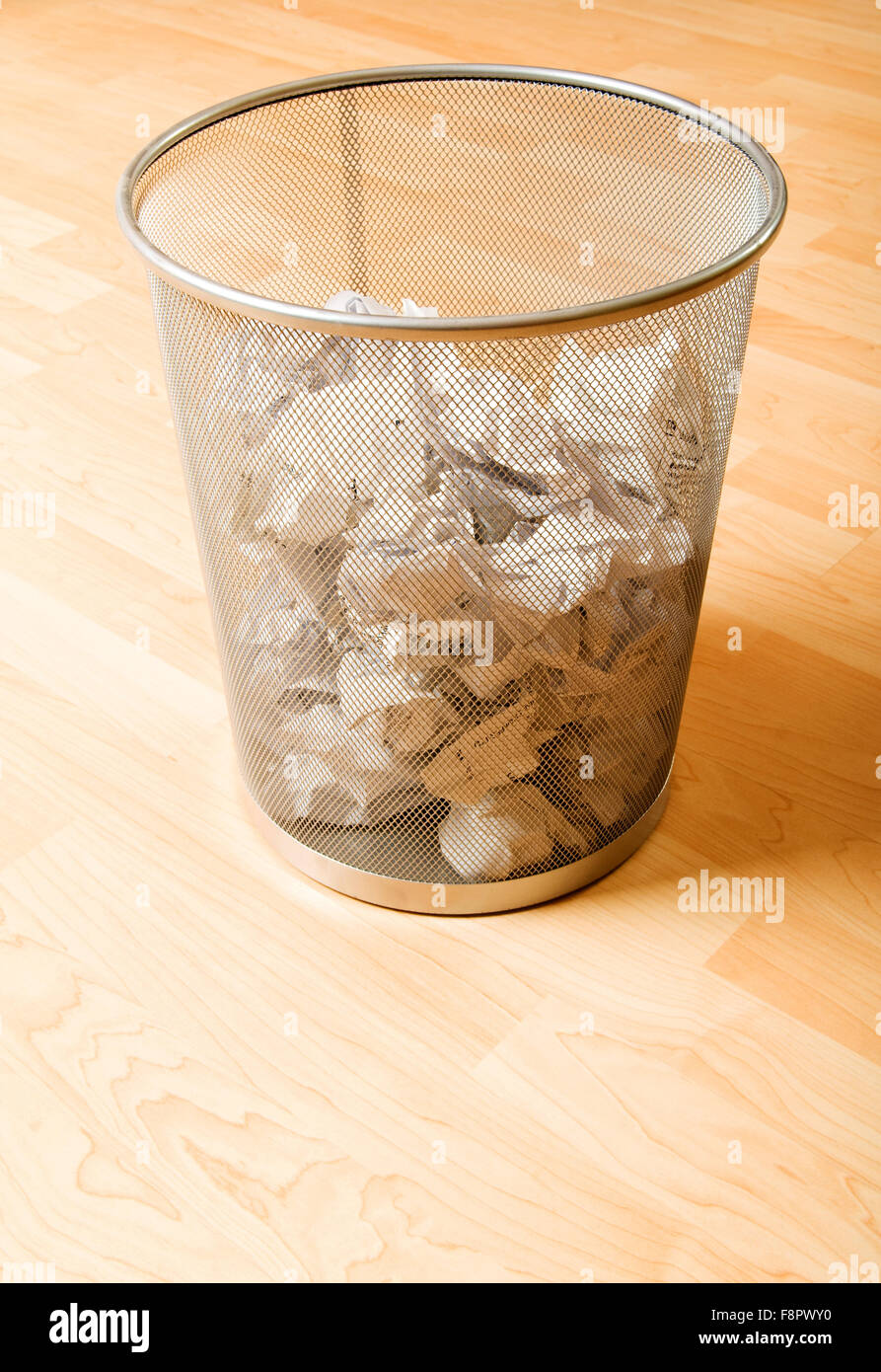 Garbage bin with paper waste isolated on white Stock Photo - Alamy