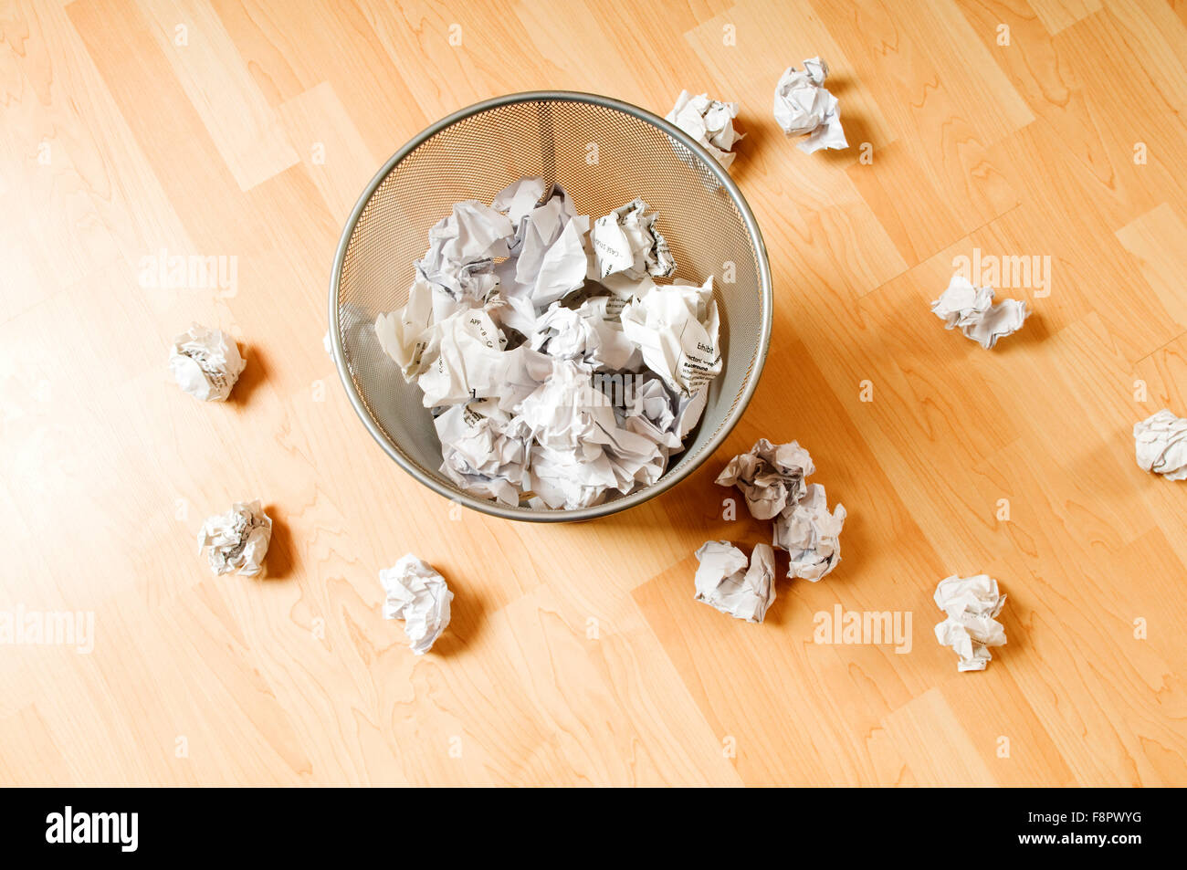 Garbage bin with paper waste isolated on white Stock Photo - Alamy