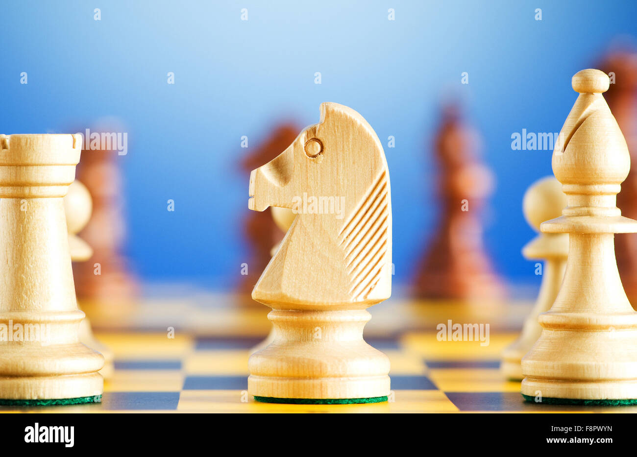 Set of chess figures on the playing board Stock Photo - Alamy