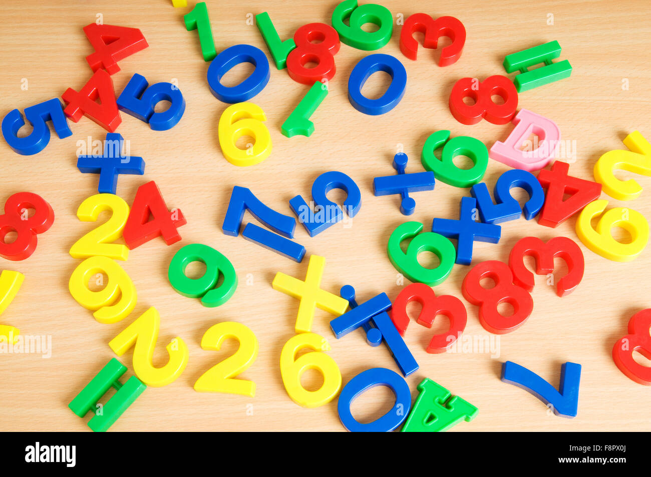 Children letters and digits on the table Stock Photo - Alamy