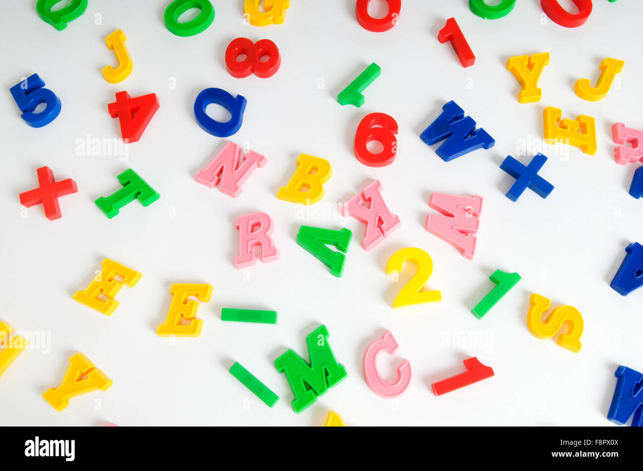 Children letters and digits on the table Stock Photo - Alamy