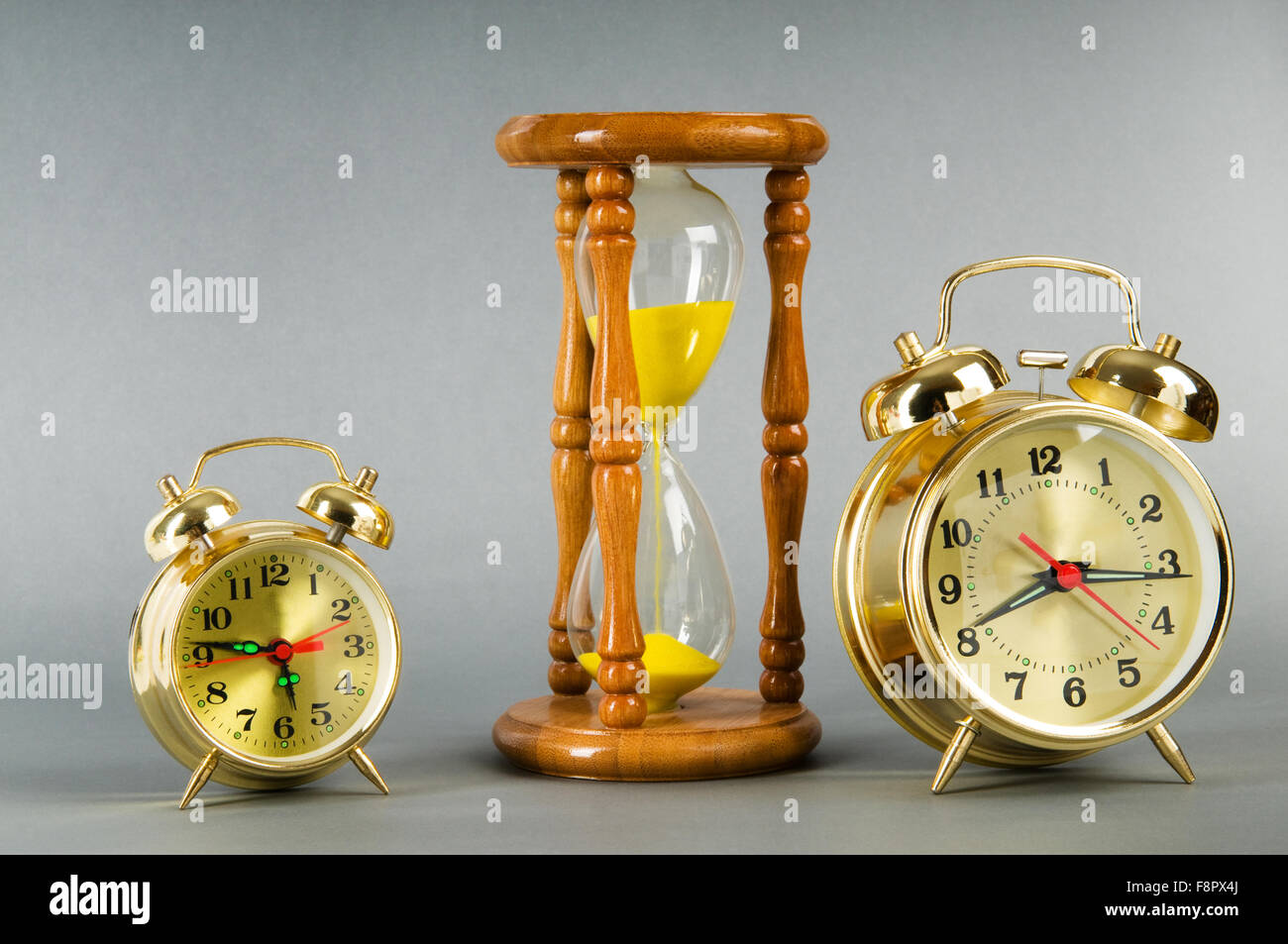 Time concept with clock and hour glass Stock Photo - Alamy