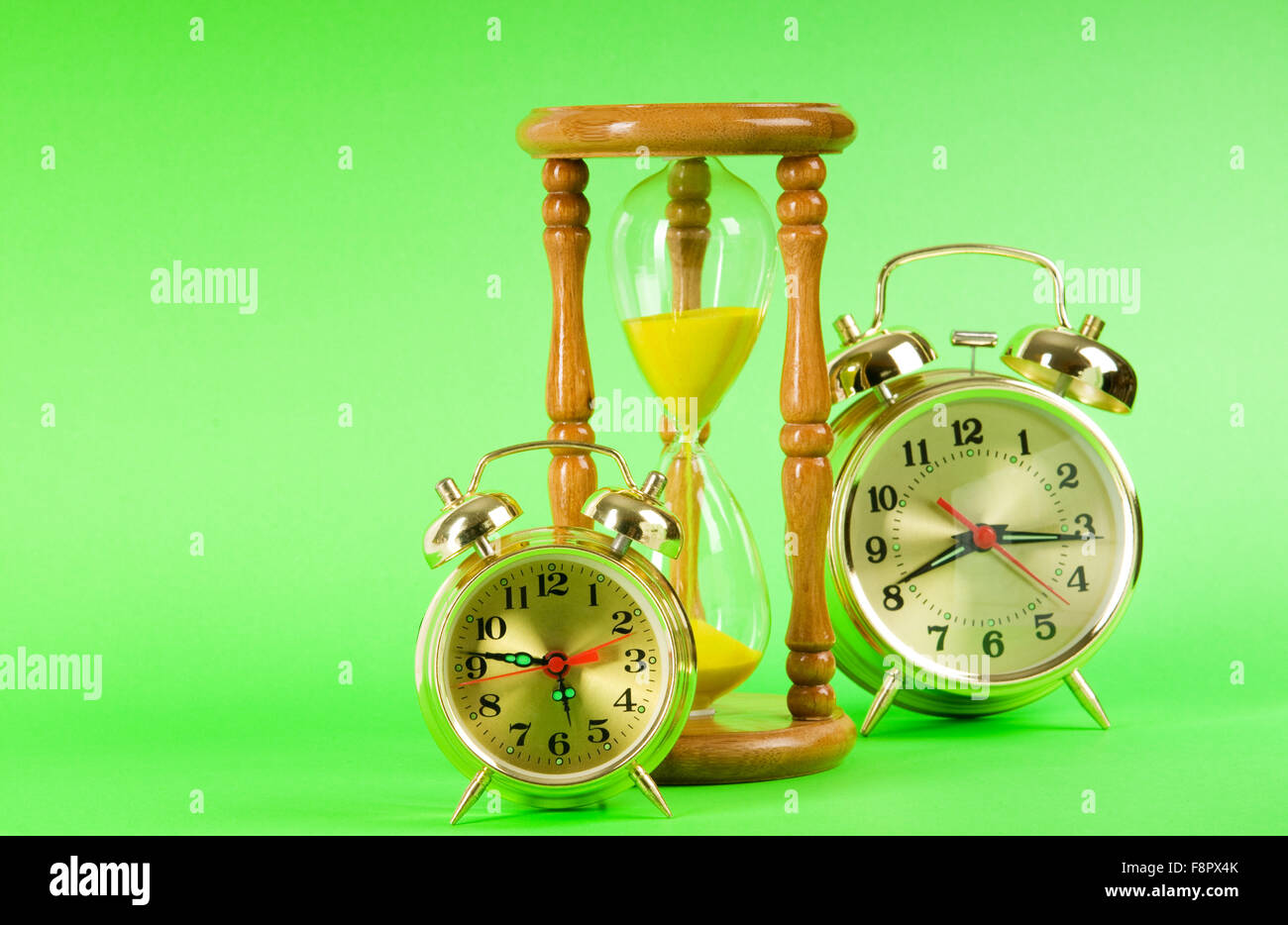 Time concept with clock and hour glass Stock Photo - Alamy