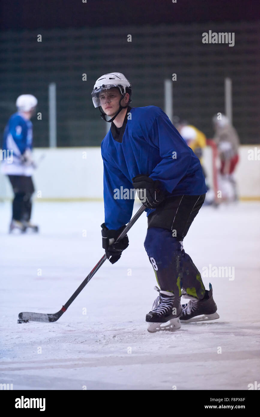 ice hockey player in action kicking with stick Stock Photo - Alamy