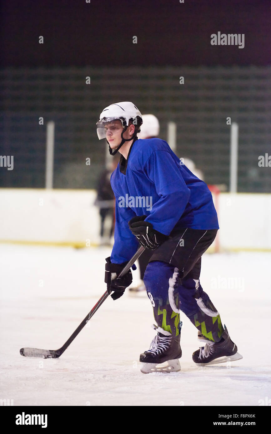 ice hockey player in action kicking with stick Stock Photo - Alamy