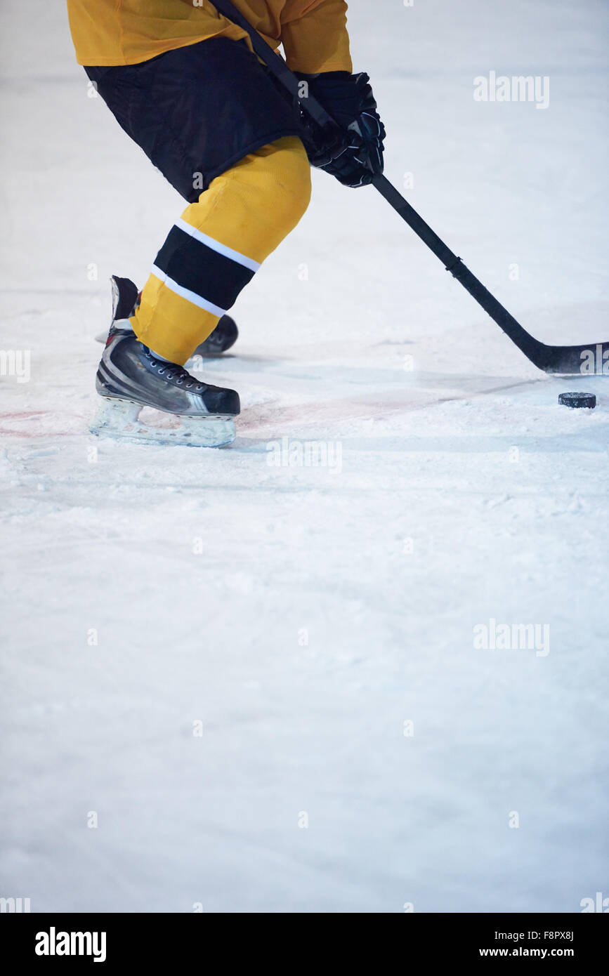 ice hockey player in action kicking with stick Stock Photo - Alamy