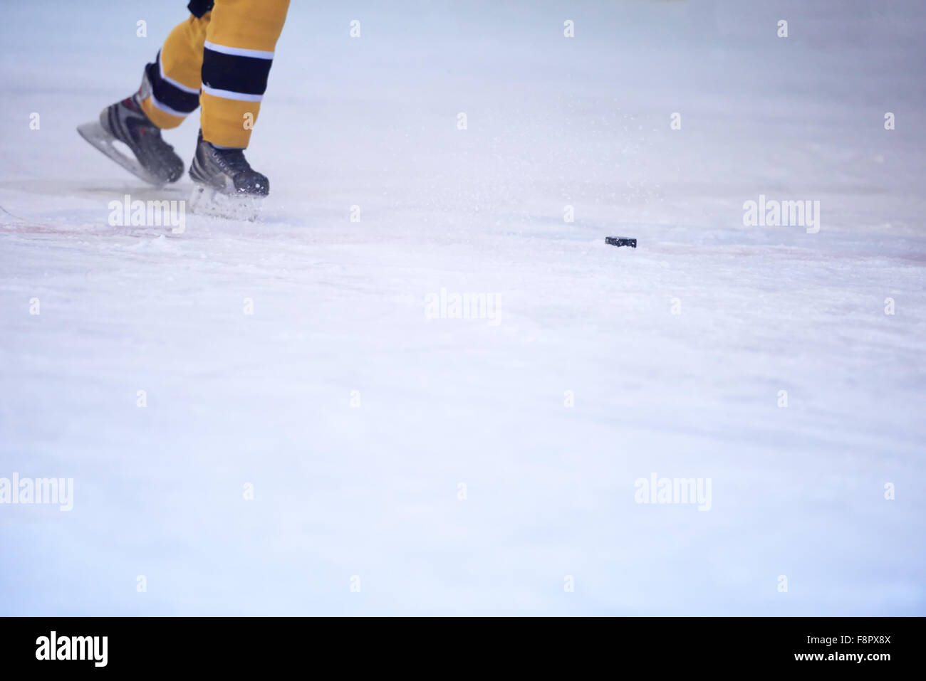 ice hockey player in action kicking with stick Stock Photo - Alamy