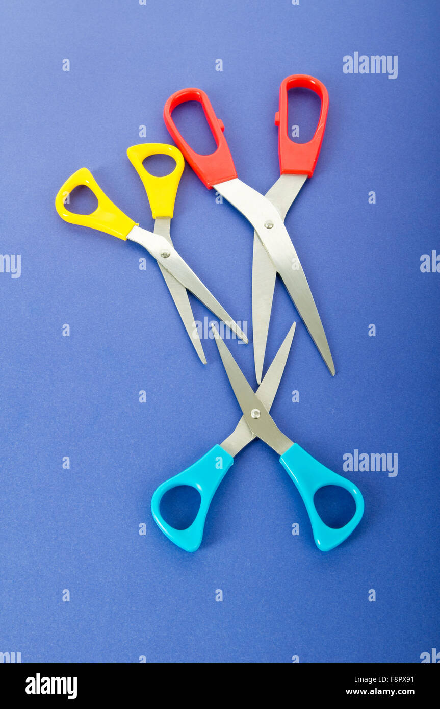 Colorful scissors on the color paper background Stock Photo - Alamy