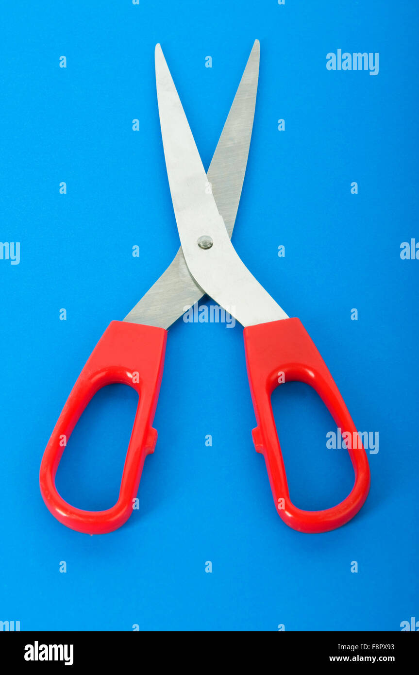 Colorful scissors on the color paper background Stock Photo - Alamy