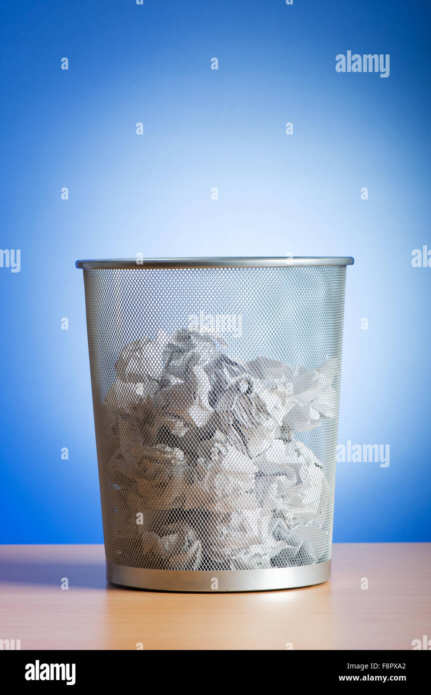 Garbage bin with paper waste isolated on white Stock Photo - Alamy