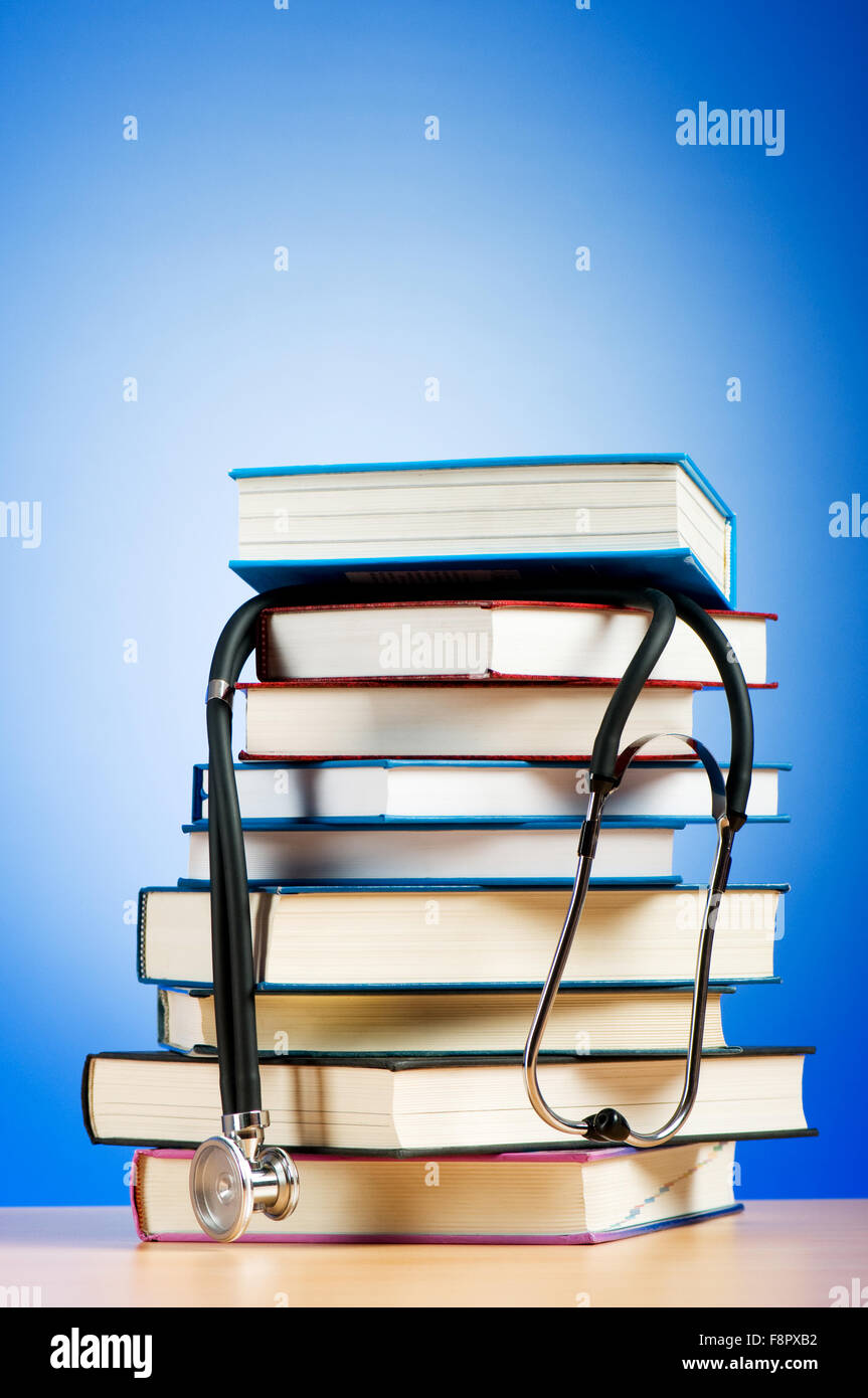 Books and stethoscope against the gradient background Stock Photo - Alamy
