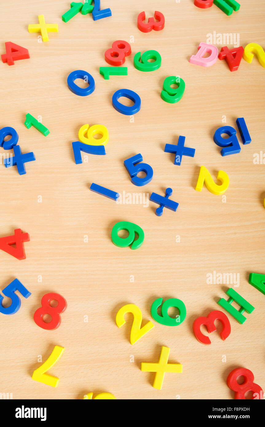Children letters and digits on the table Stock Photo - Alamy