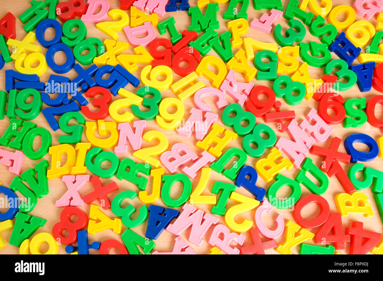 Children letters and digits on the table Stock Photo - Alamy