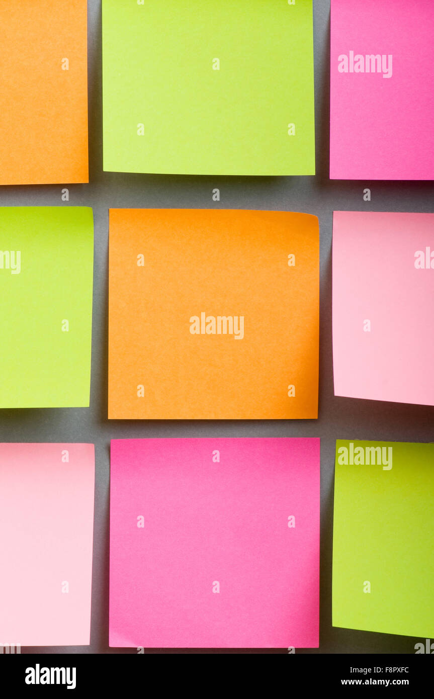 Reminder notes on the bright colorful paper Stock Photo - Alamy