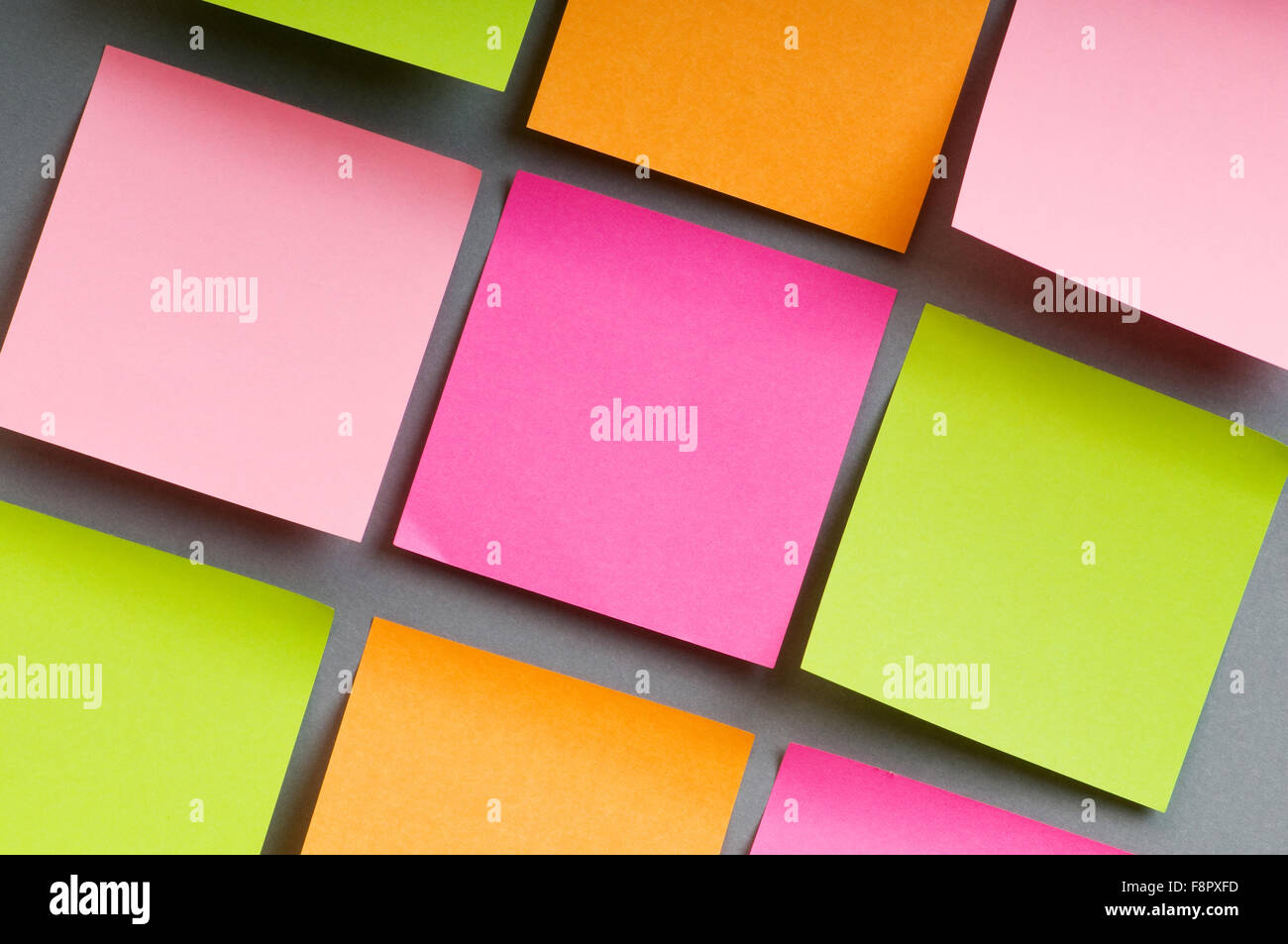 Reminder notes on the bright colorful paper Stock Photo - Alamy