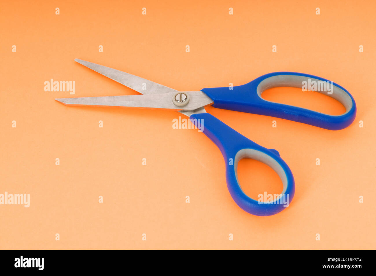 Colorful scissors on the color paper background Stock Photo - Alamy