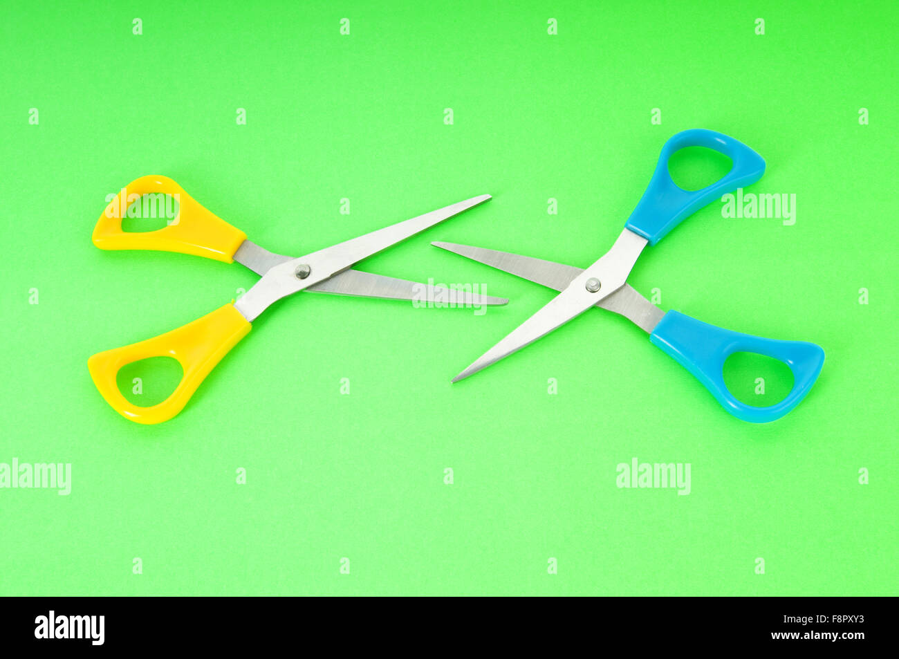 Colorful scissors on the color paper background Stock Photo - Alamy