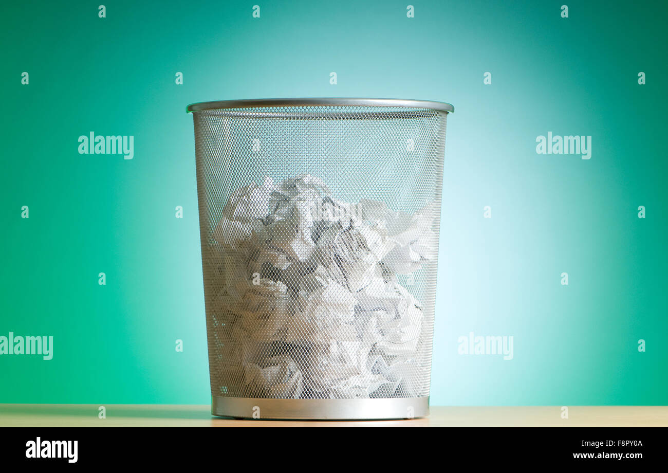 Garbage bin with paper waste isolated on white Stock Photo - Alamy