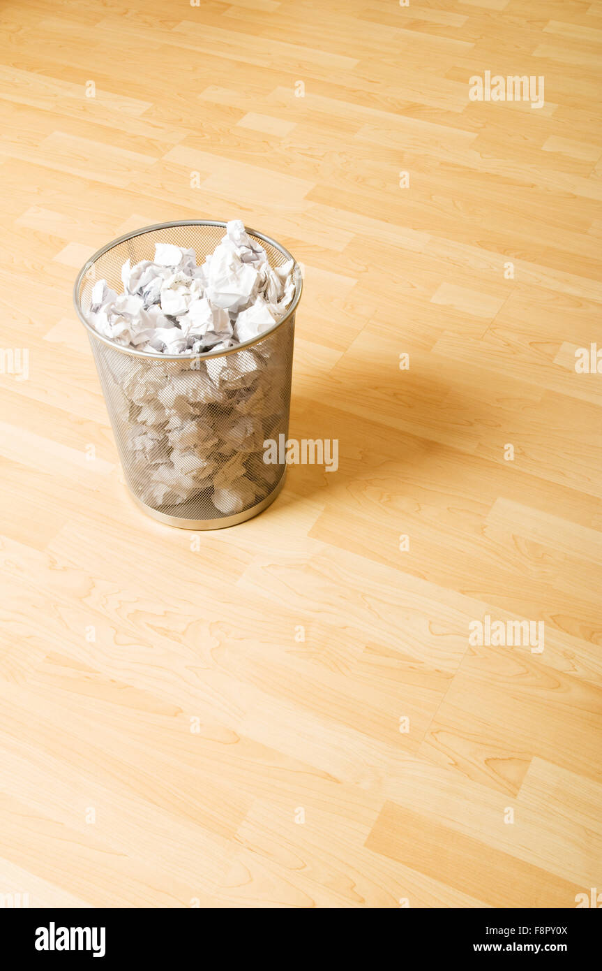 Garbage bin with paper waste isolated on white Stock Photo - Alamy