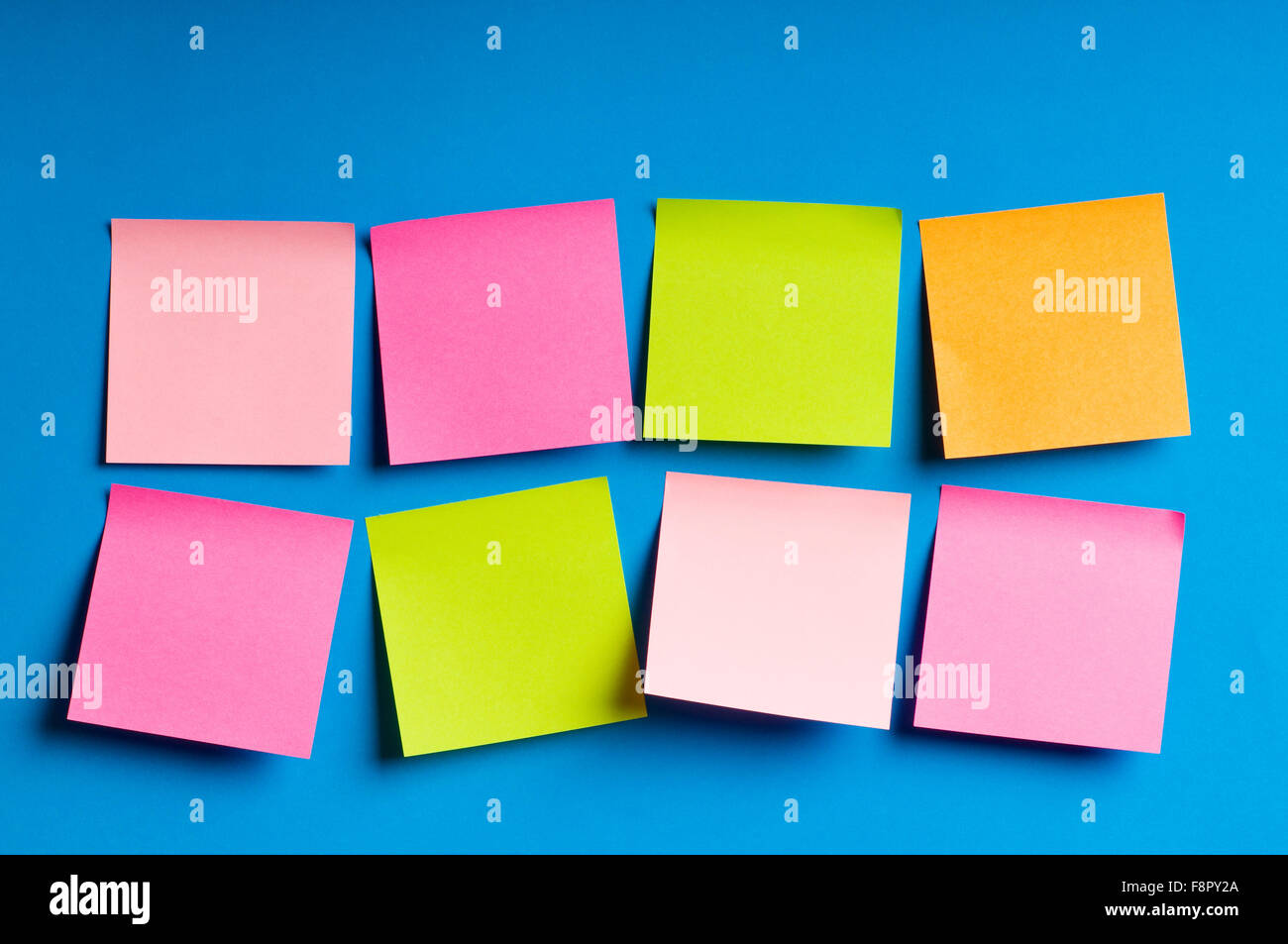 Reminder notes on the bright colorful paper Stock Photo - Alamy