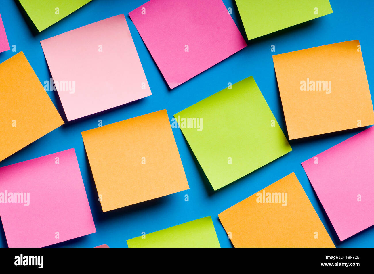 Reminder notes on the bright colorful paper Stock Photo - Alamy