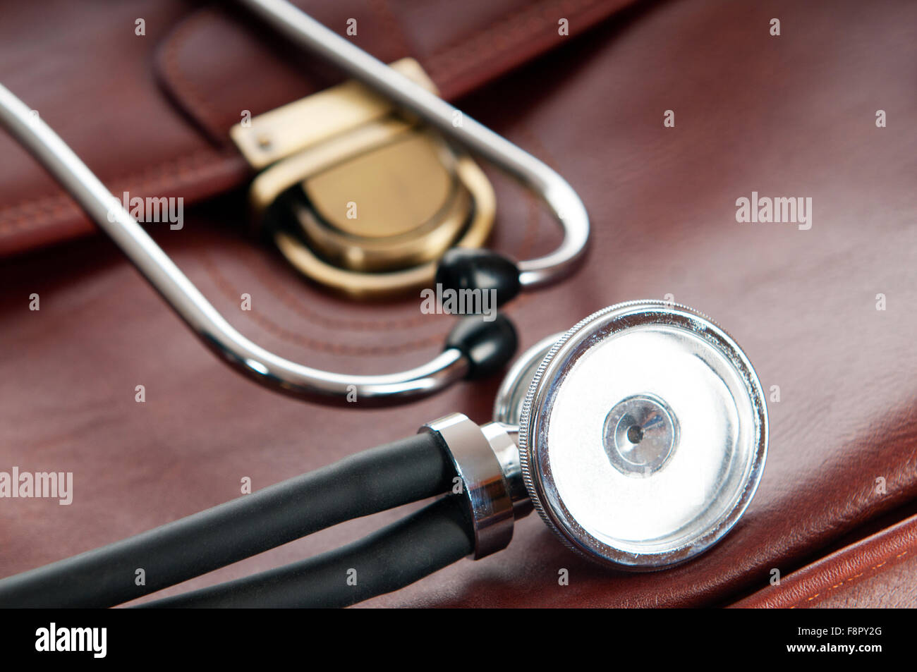 Leather briefcase and stethoscope hi-res stock photography and images ...