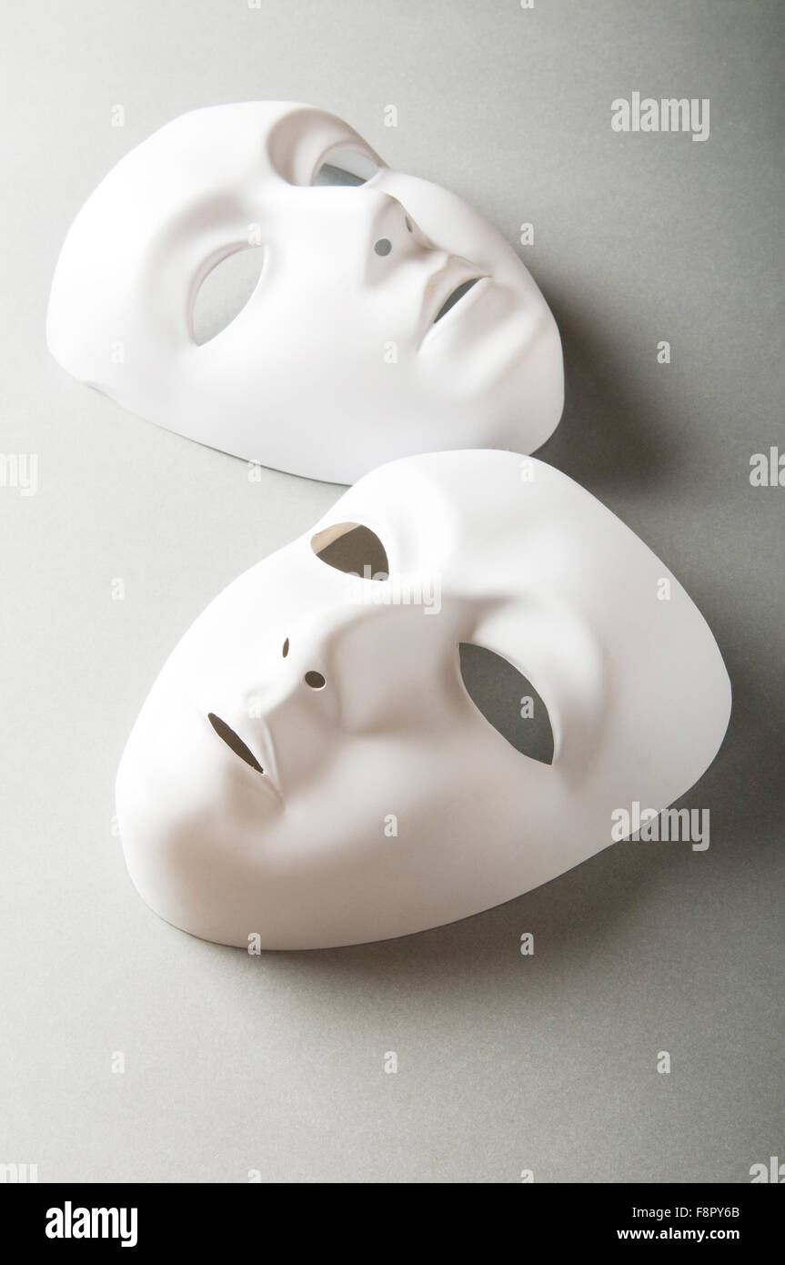 Theatre concept with the white plastic masks Stock Photo - Alamy