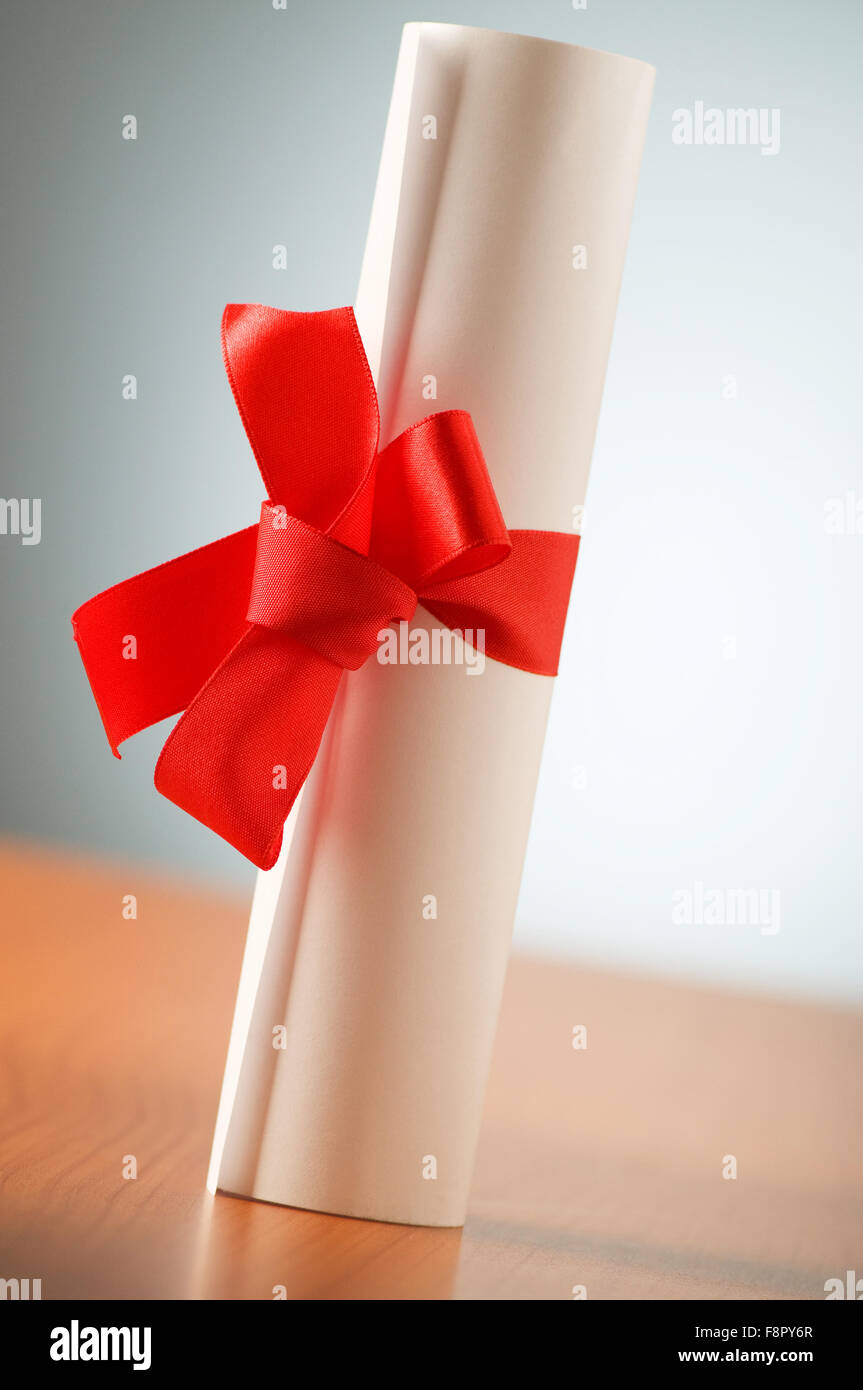 Education concept - diploma roll on the wooden table Stock Photo - Alamy