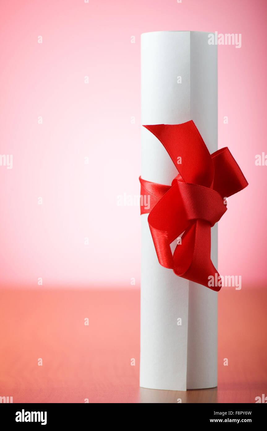 Education concept - diploma roll on the wooden table Stock Photo - Alamy