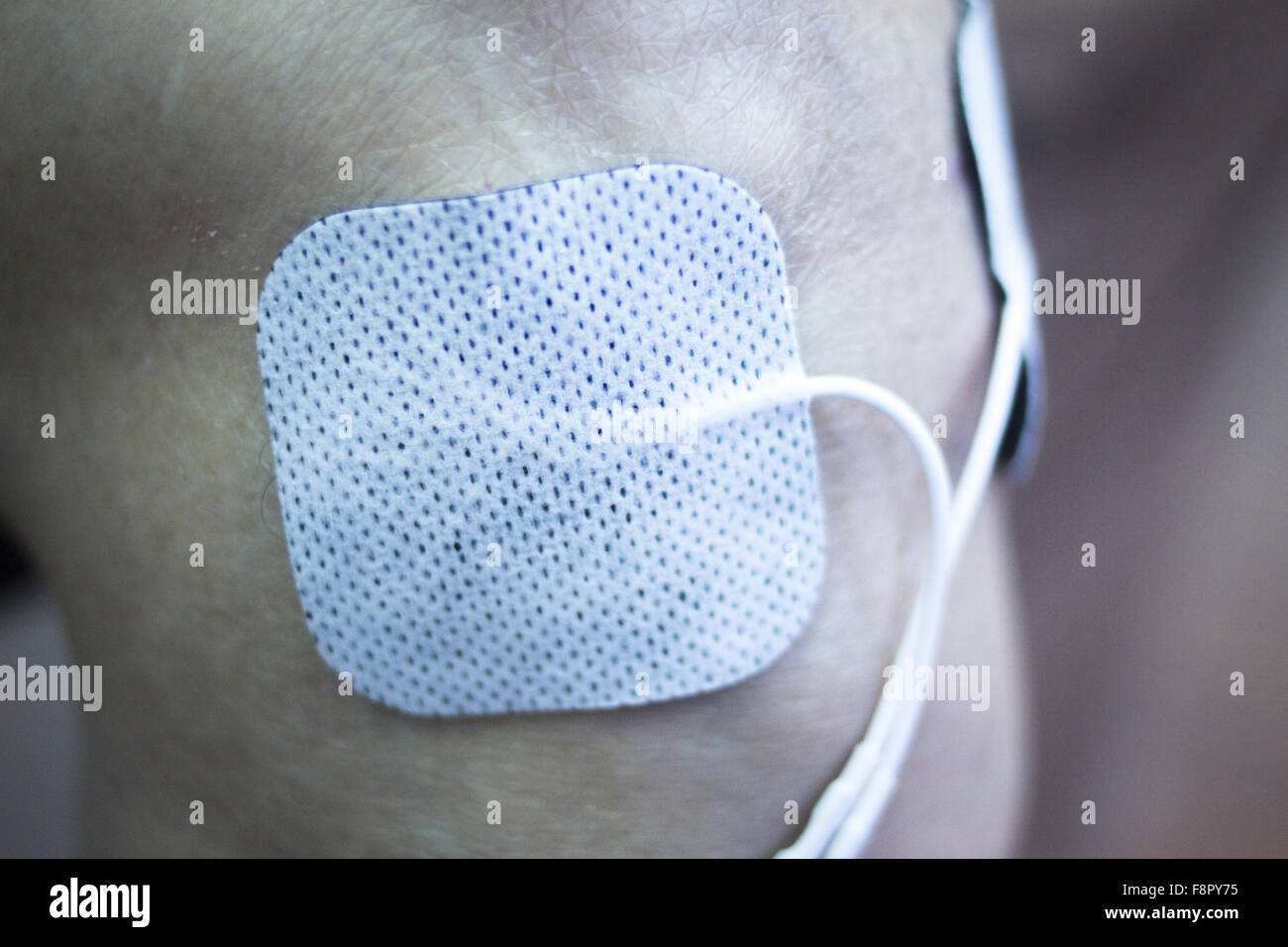 Patient leg and knee in electro physiotherapy electrical impulse ...