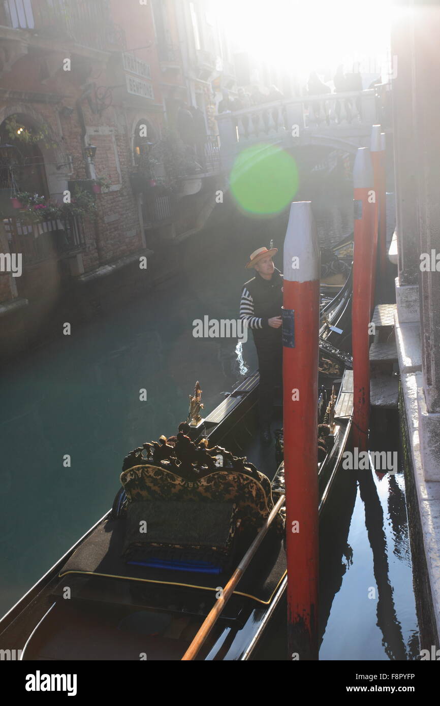 Gondolier on canals of Venice in the early morning Stock Photo - Alamy