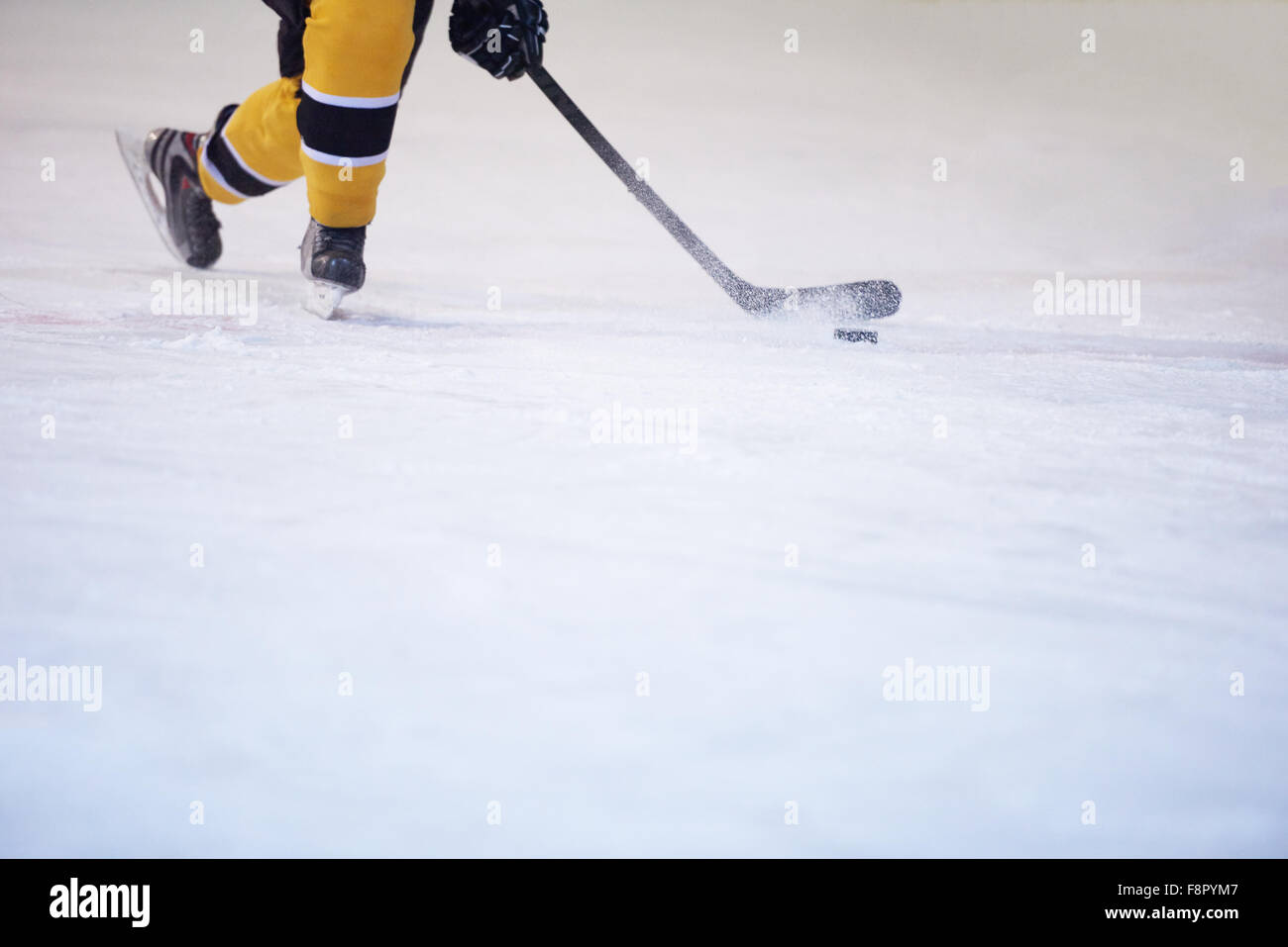 ice hockey player in action kicking with stick Stock Photo - Alamy