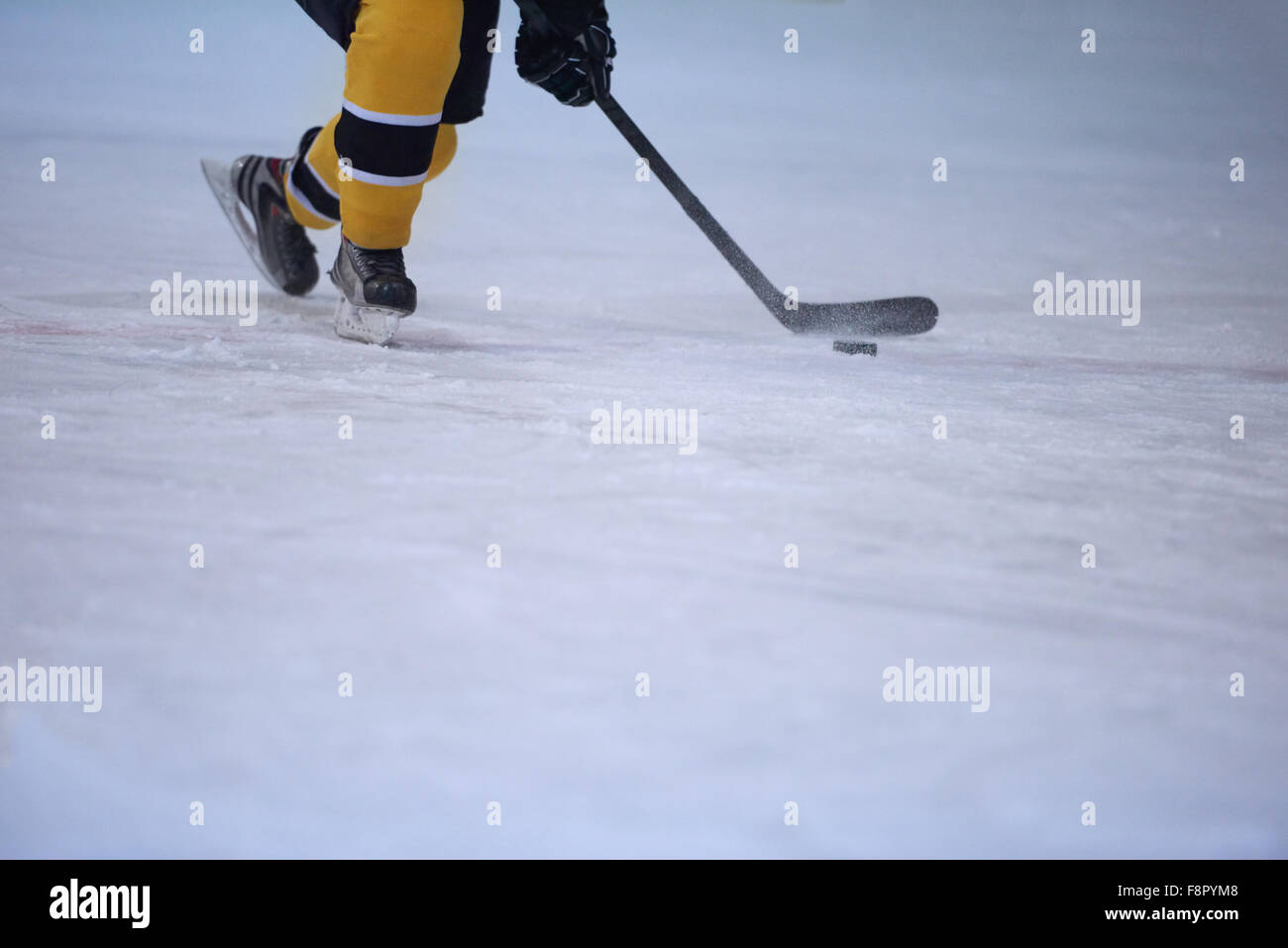 ice hockey player in action kicking with stick Stock Photo - Alamy