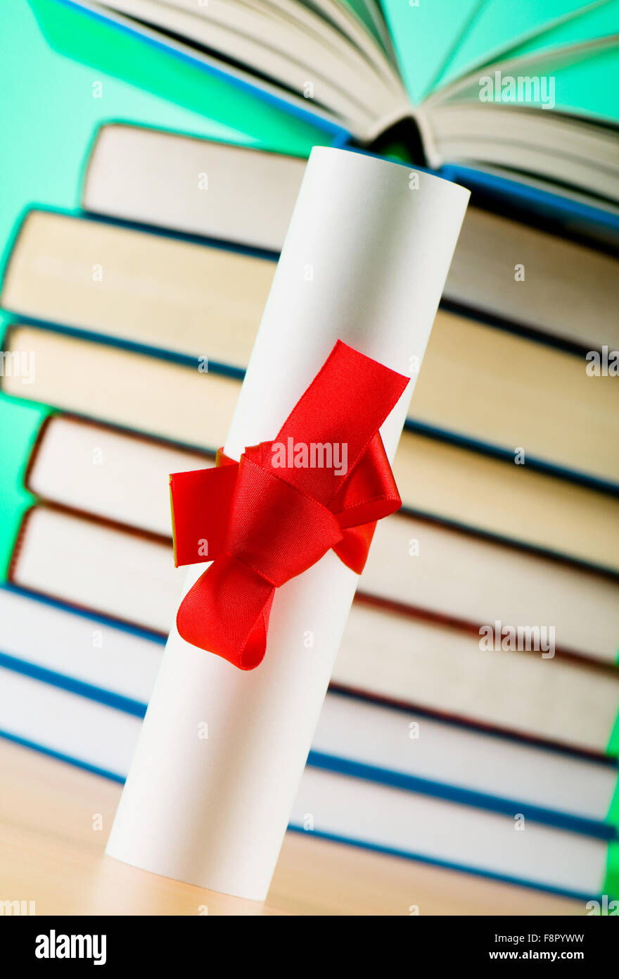 Diploma and stack of books against the background Stock Photo - Alamy