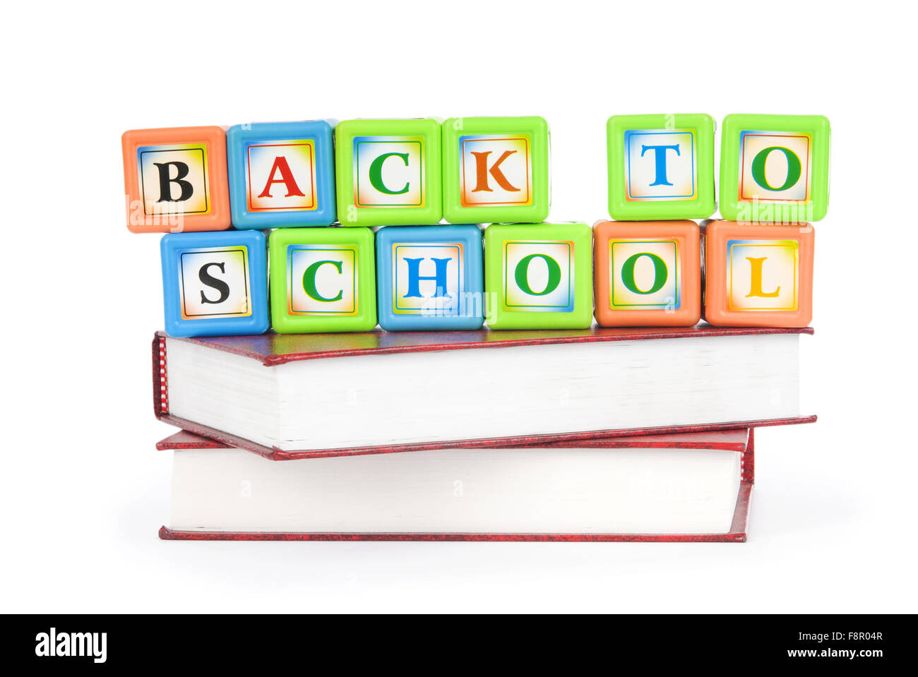 Books and alphabet blocks isolated on white Stock Photo - Alamy