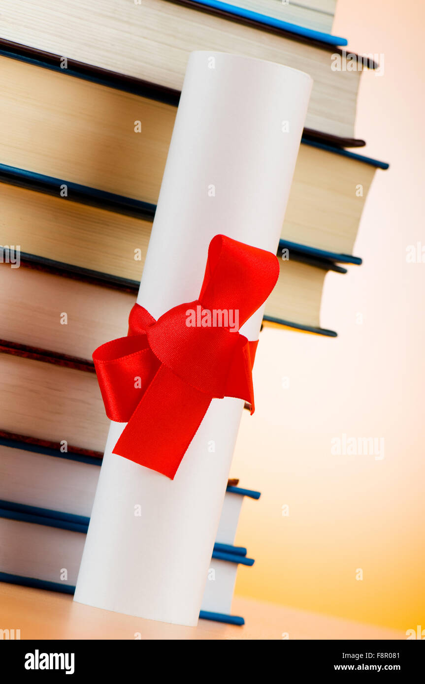 Diploma and stack of books against the background Stock Photo - Alamy