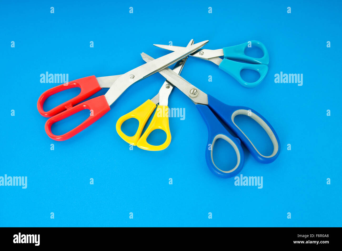Colorful scissors on the color paper background Stock Photo - Alamy