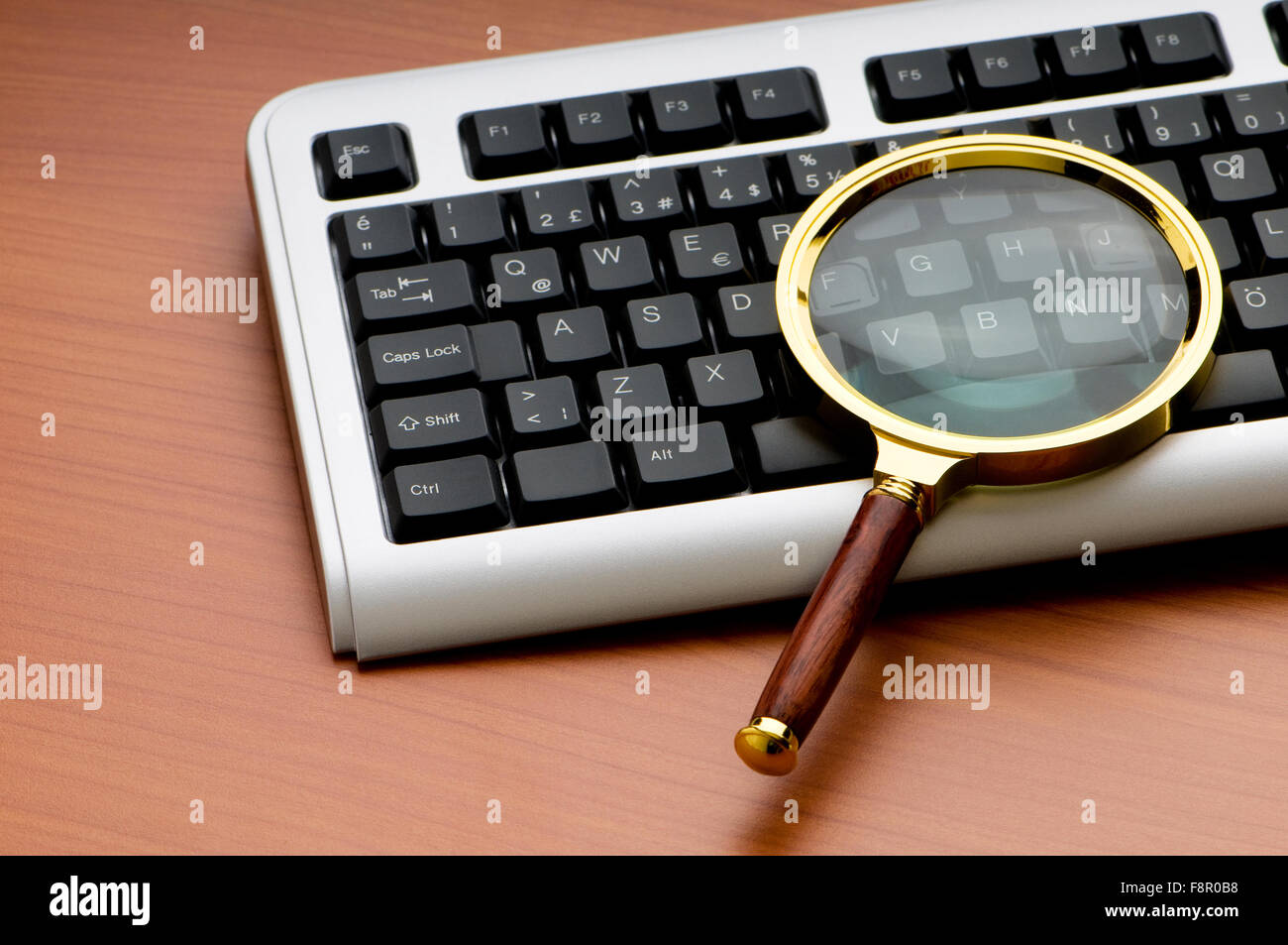Computer security concept with keyboard and magnifying glass Stock ...