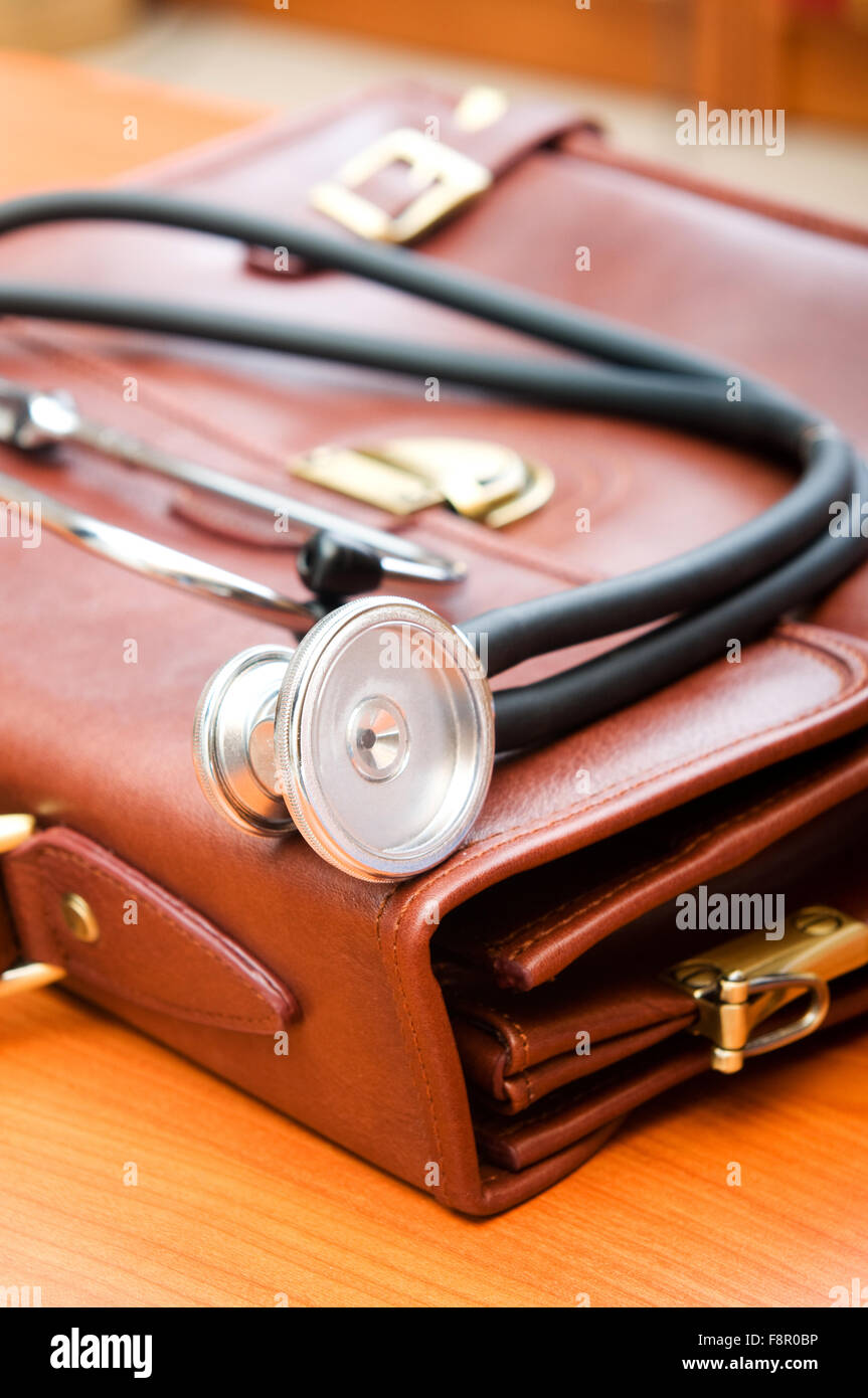 Doctor's case with stethoscope against wooden background Stock Photo ...