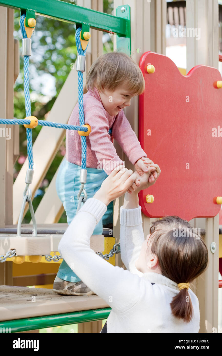mother with child at playground area in summer Stock Photo - Alamy