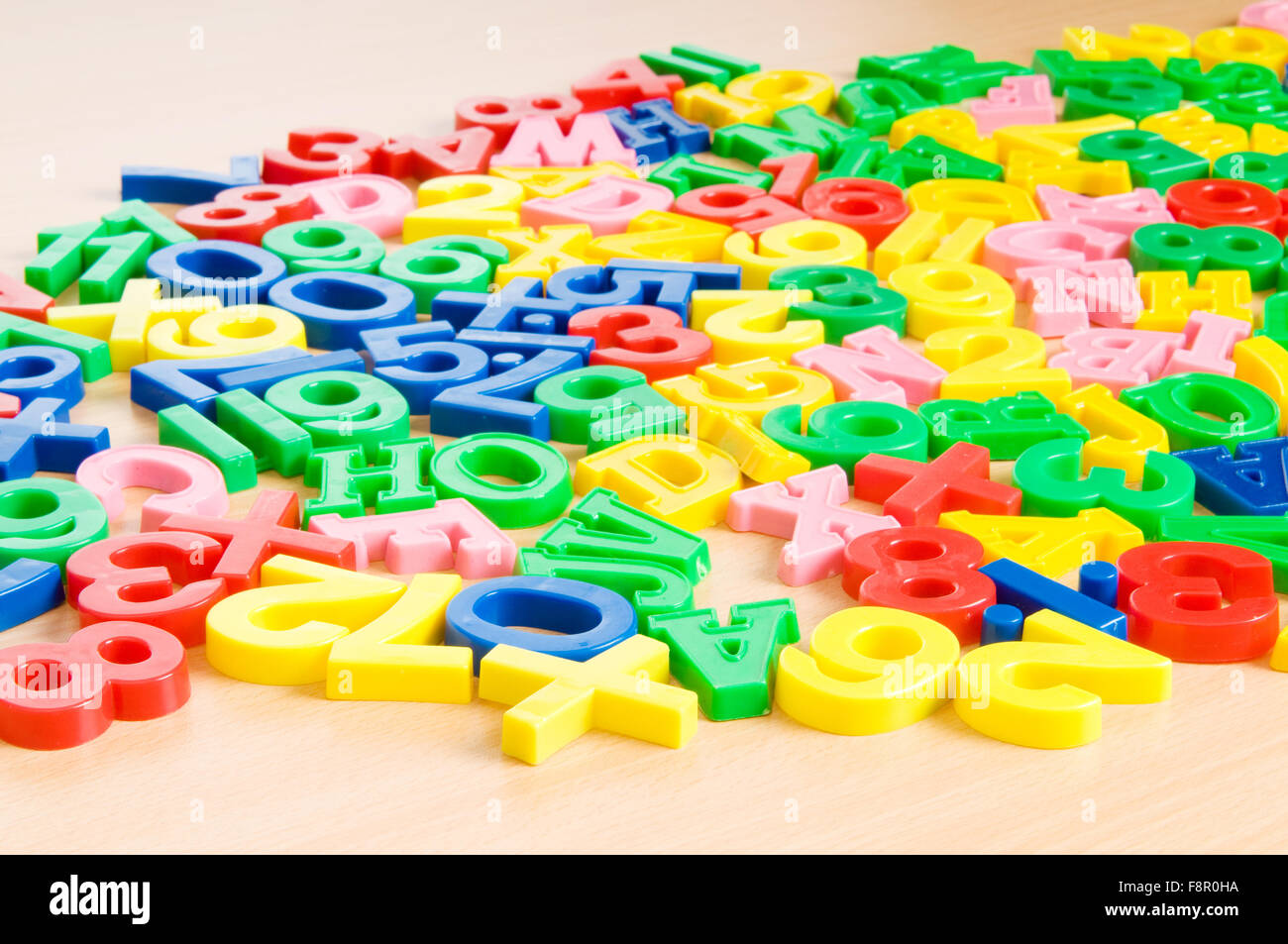 Children letters and digits on the table Stock Photo - Alamy