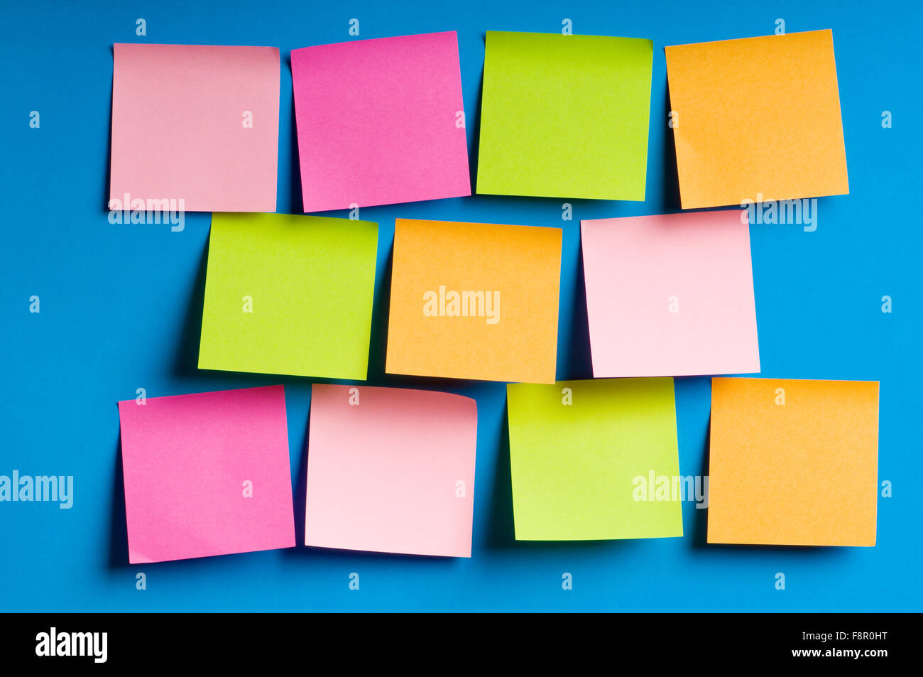 Reminder notes on the bright colorful paper Stock Photo - Alamy