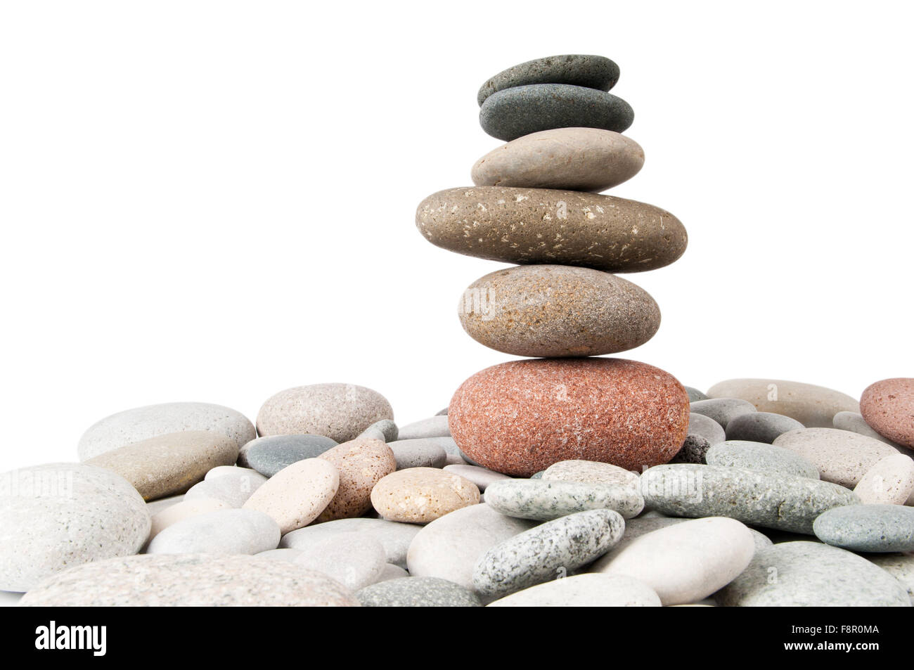 Stack of pebbles isolated on the white Stock Photo - Alamy