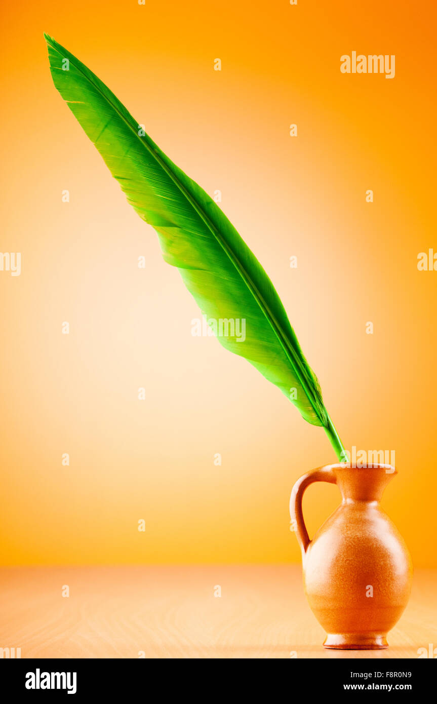 Writing feather against gradient background Stock Photo - Alamy