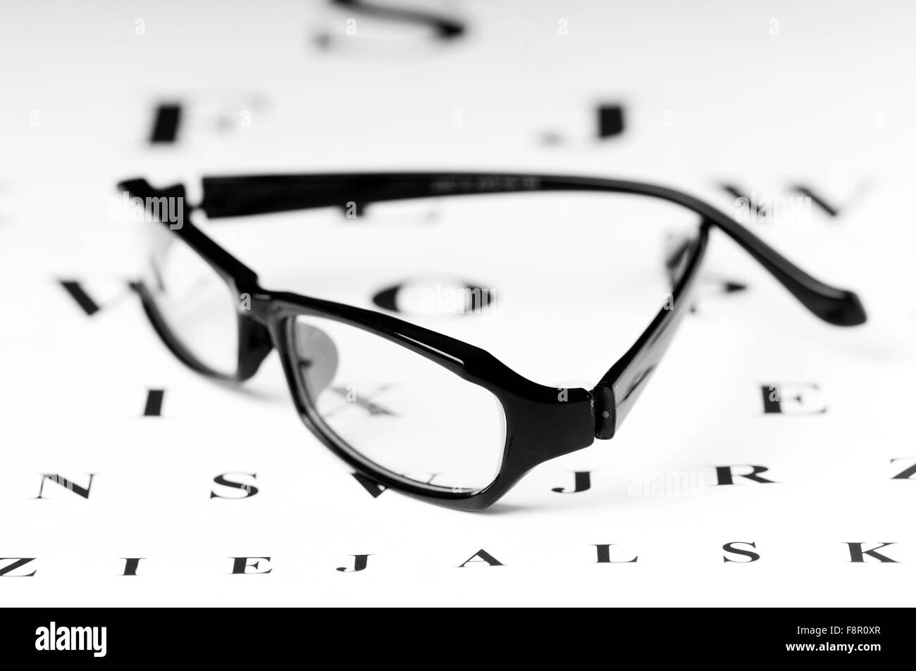 Optical reading glasses on the eyesight table Stock Photo - Alamy