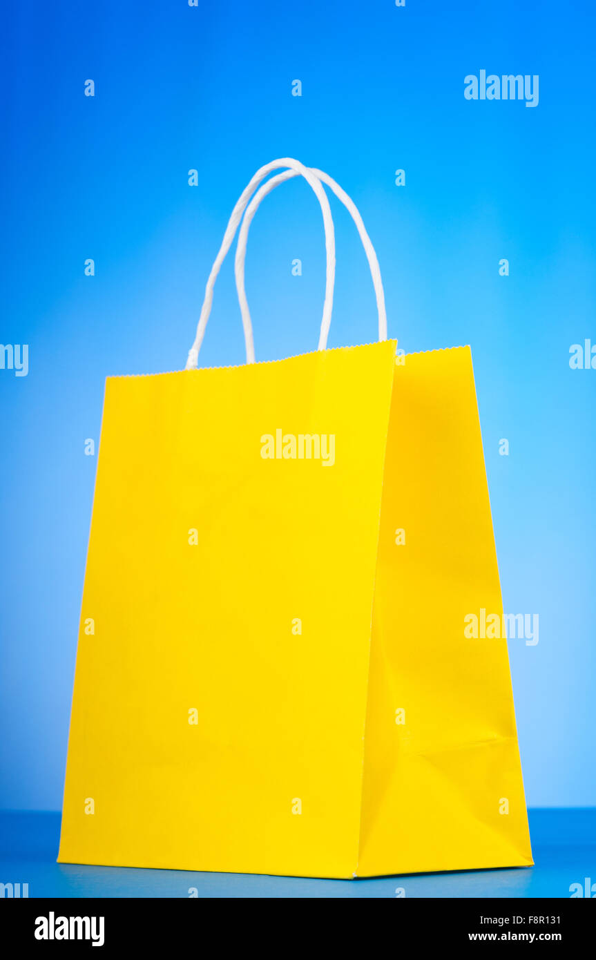 Colourful paper shopping bags against gradient background Stock Photo ...