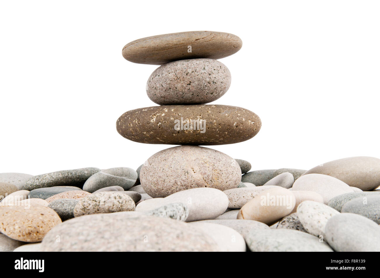 Stack of pebbles isolated on the white Stock Photo - Alamy