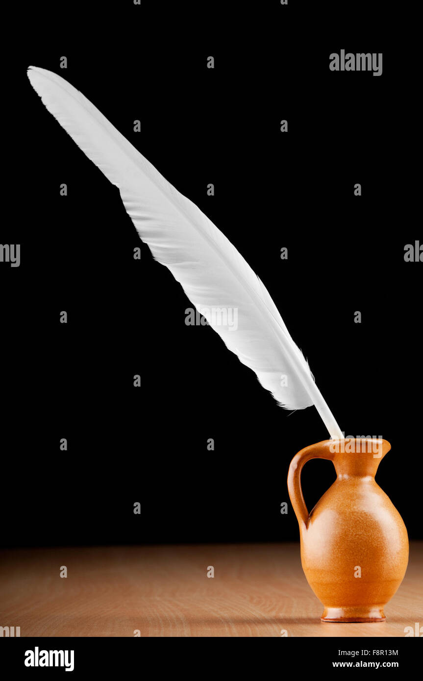 Writing feather against gradient background Stock Photo - Alamy